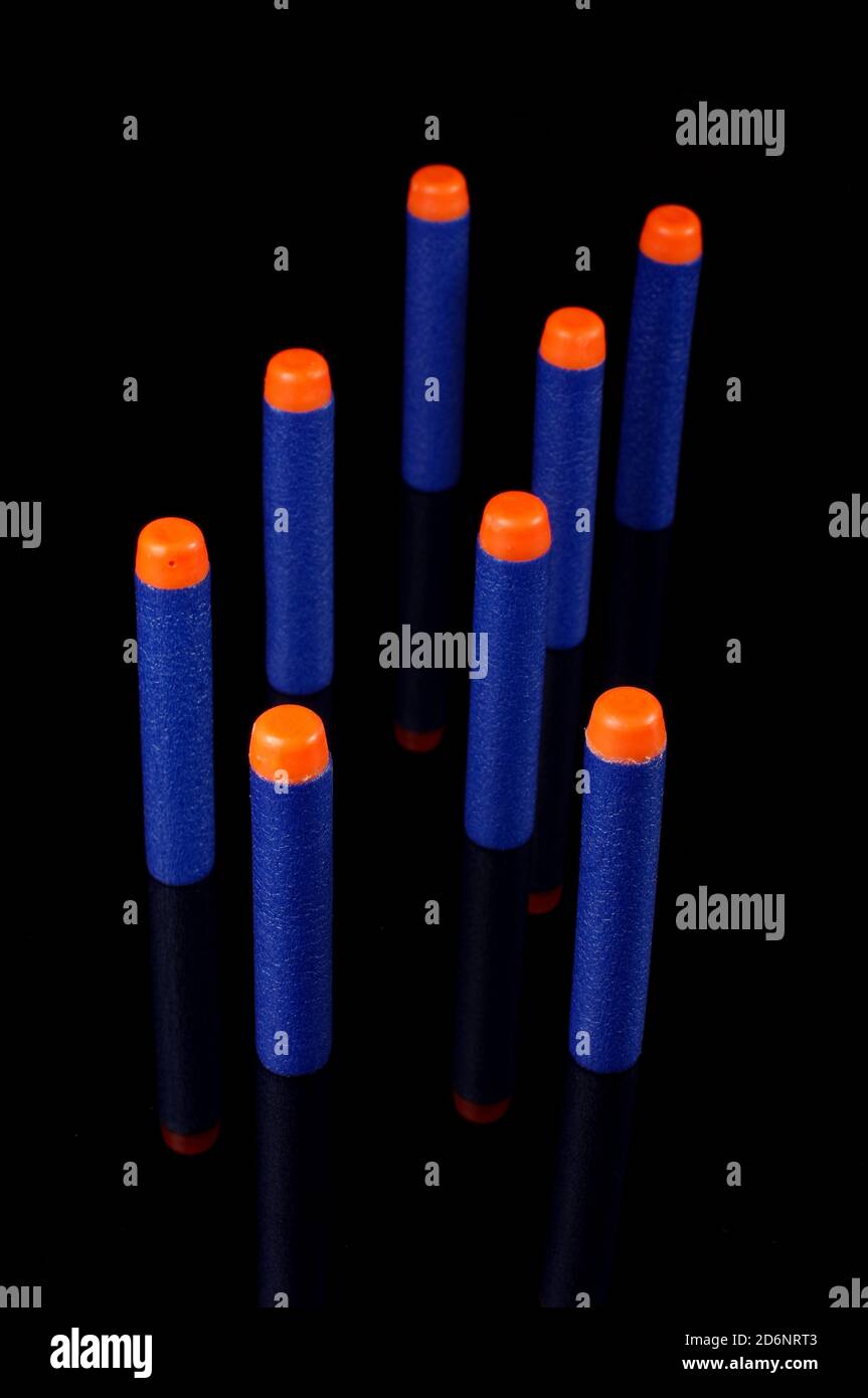 Toy gun bullets made from foam and rubber isolated on the black ...