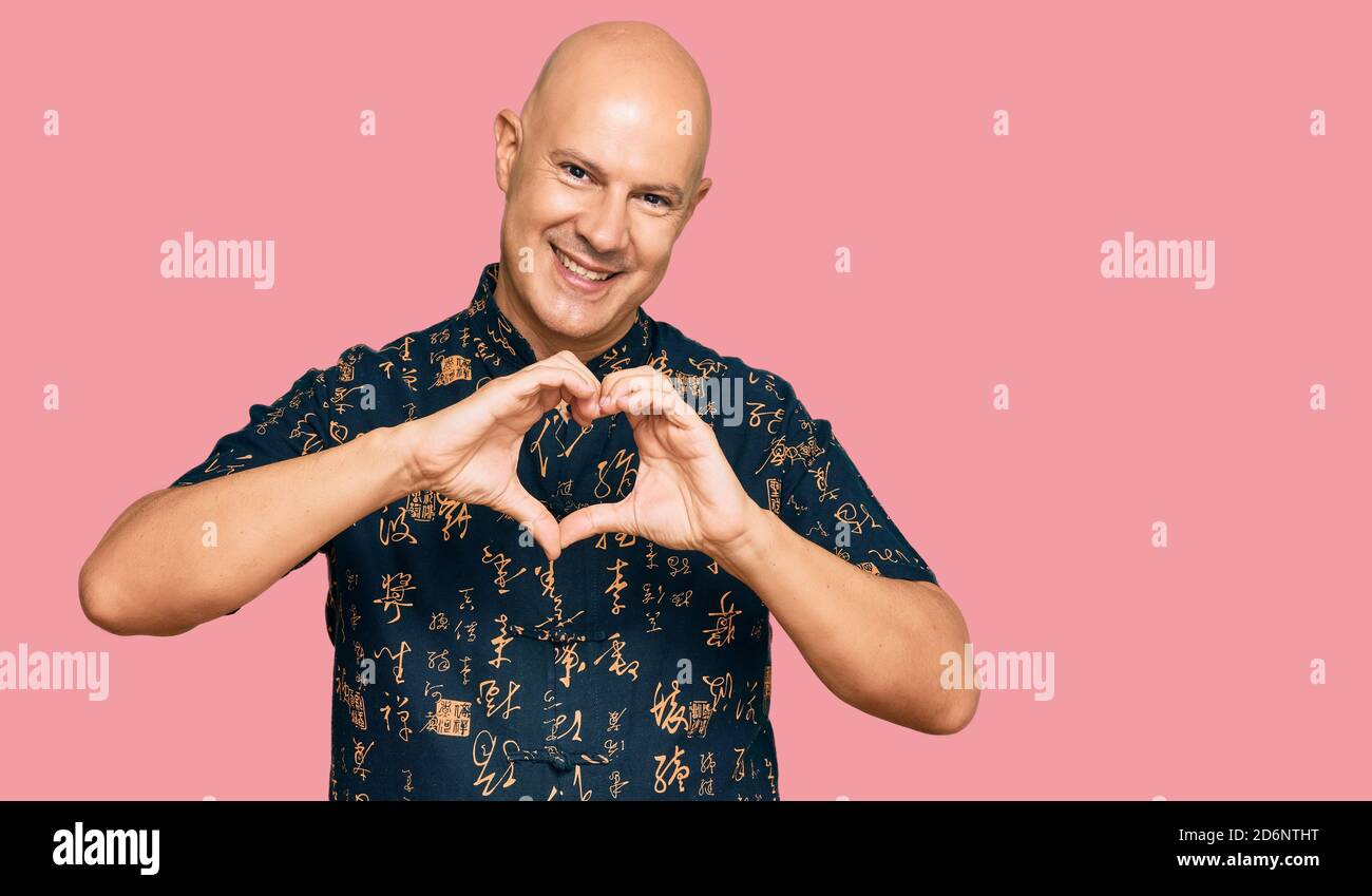 Middle age bald man wearing casual clothes smiling in love showing ...