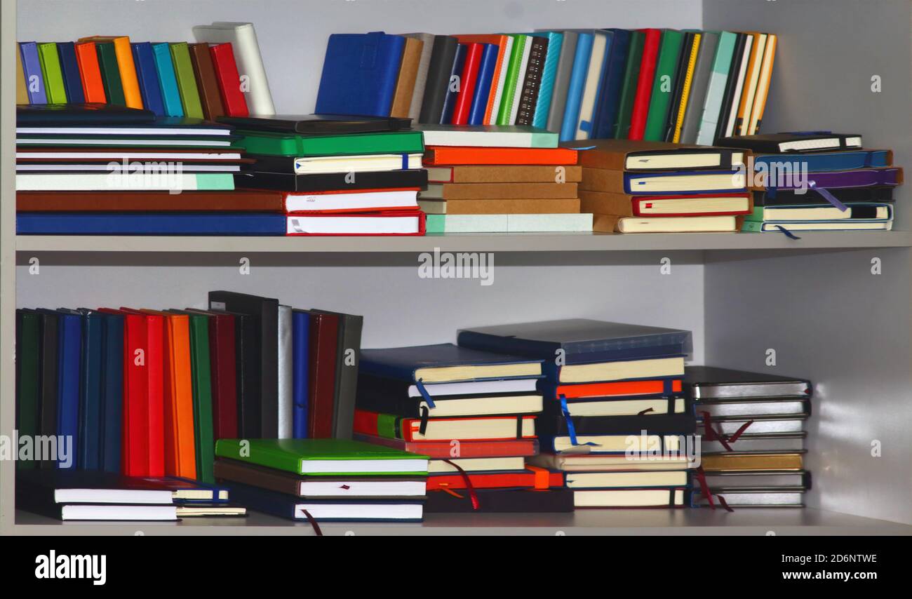 Stack of various sample leather-bound diaries or books in a gray ...