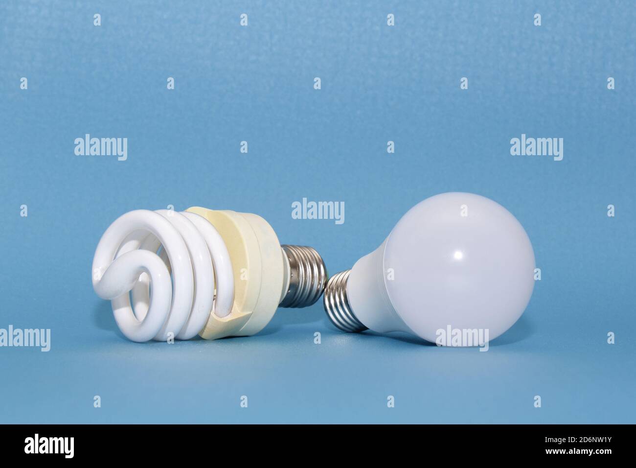 Old dirty fluorescent and new led lamps on blue background Stock Photo ...