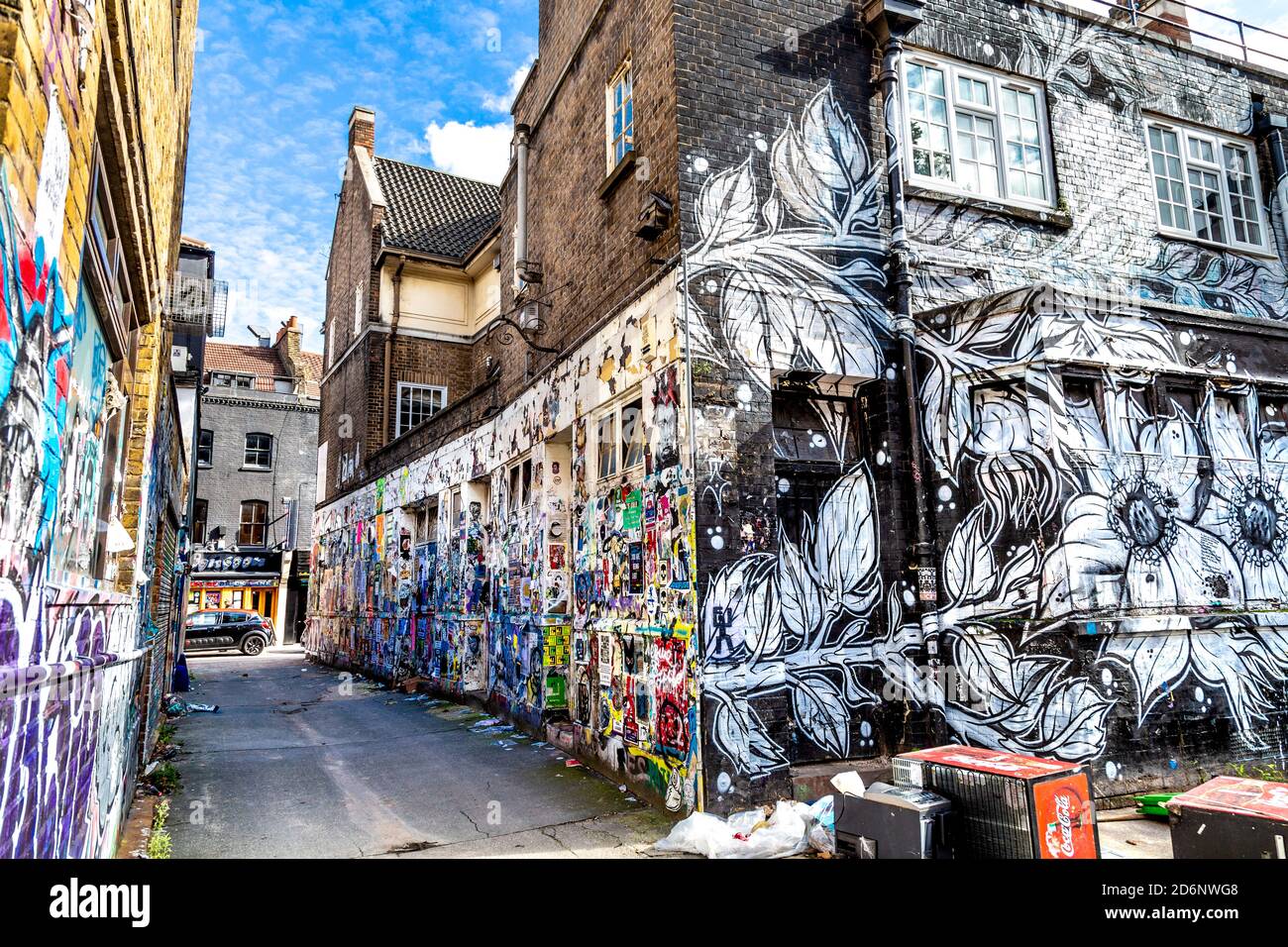 Walls covered in graffiti, posters and artwork by Brick Lane, East ...