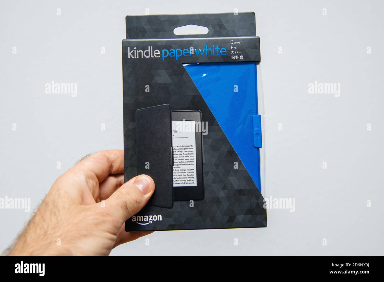 Paris, France - Mar 14, 2018: Male hand holding package of new Amazon ...