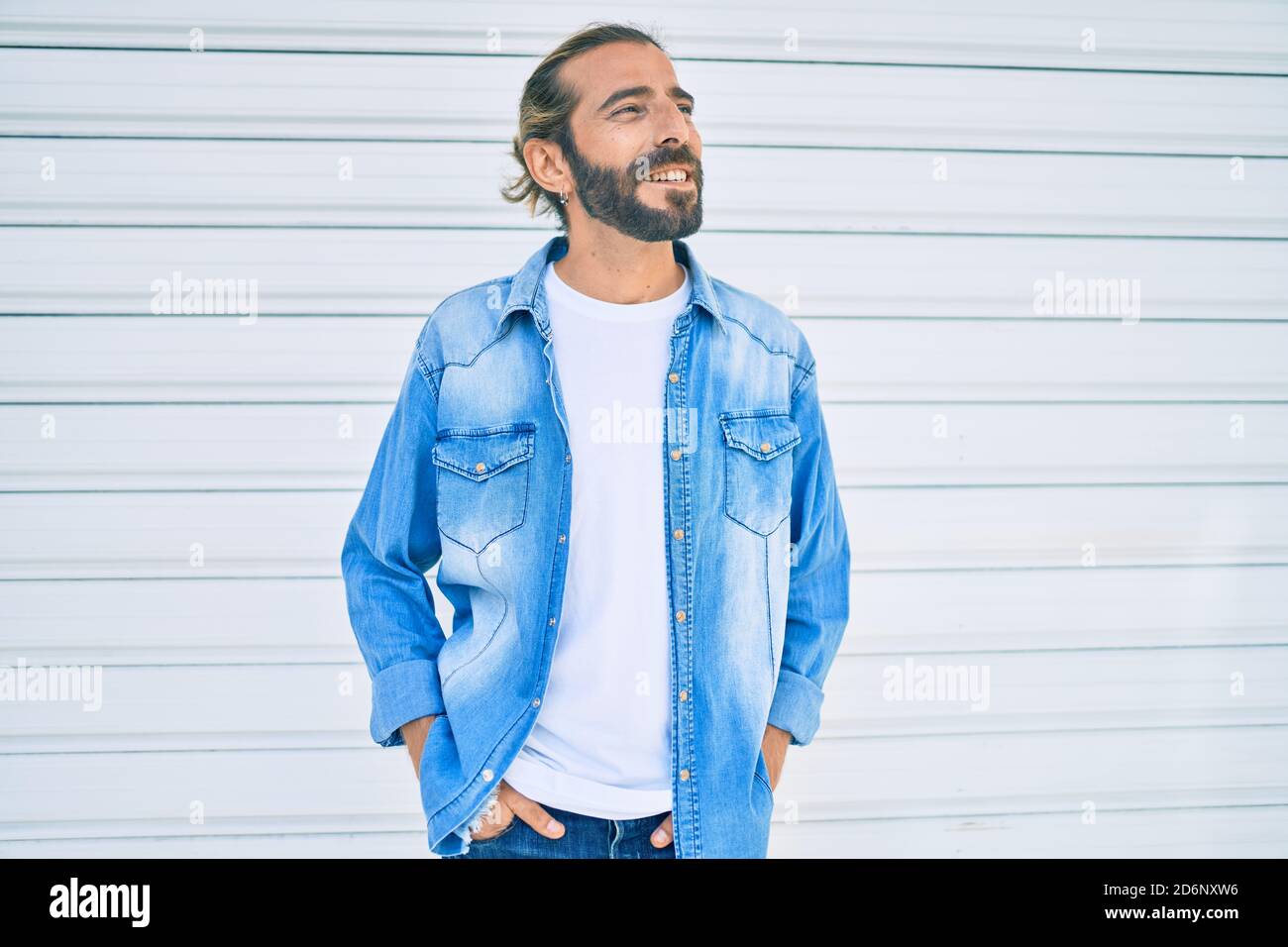Young middle eastern man smiling happy walking at the city Stock Photo ...