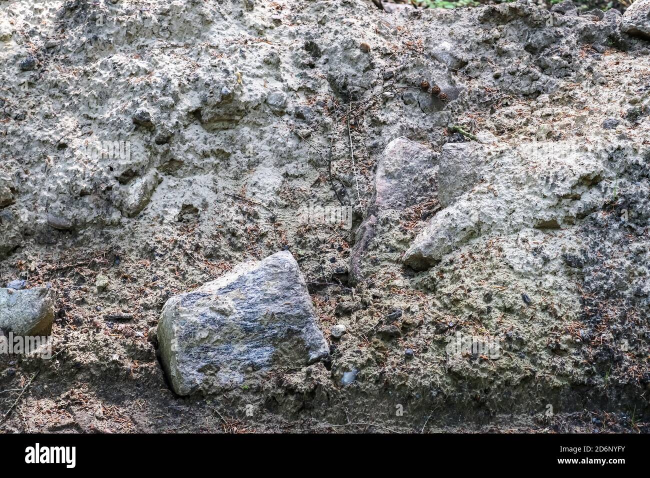 Detailed close up view on pebbles and stones on a gravel ground texture ...