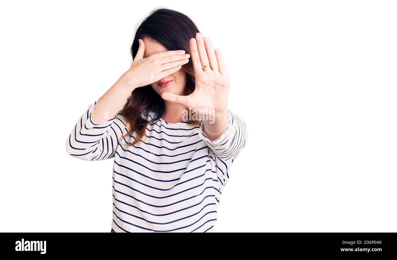 Beautiful young brunette woman wearing casual clothes and glasses ...