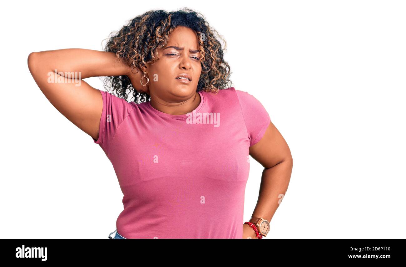 Young african american plus size woman wearing casual clothes suffering ...