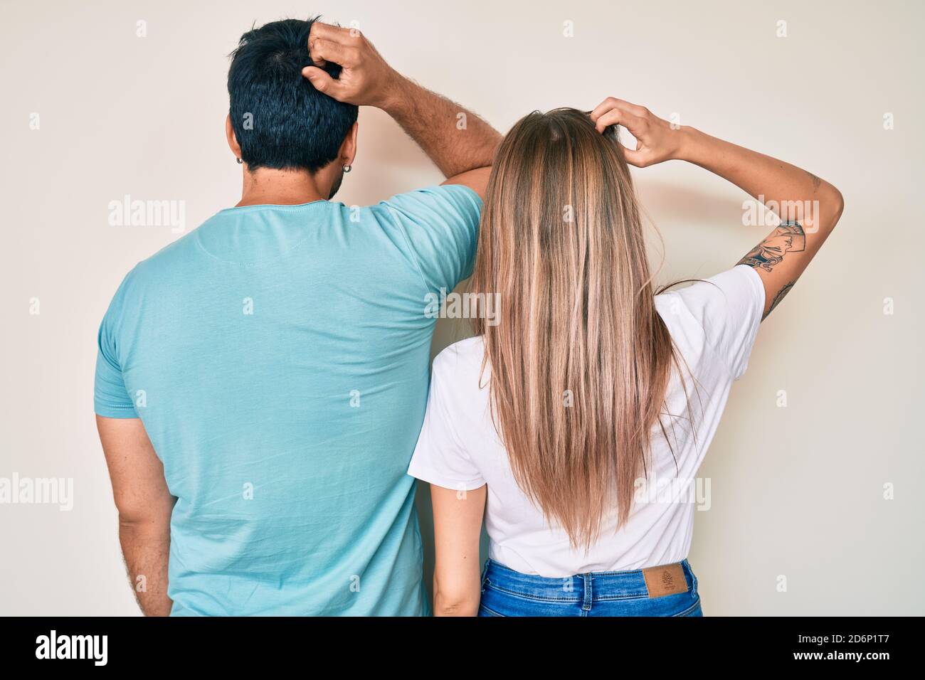 Beautiful young couple of boyfriend and girlfriend together backwards ...
