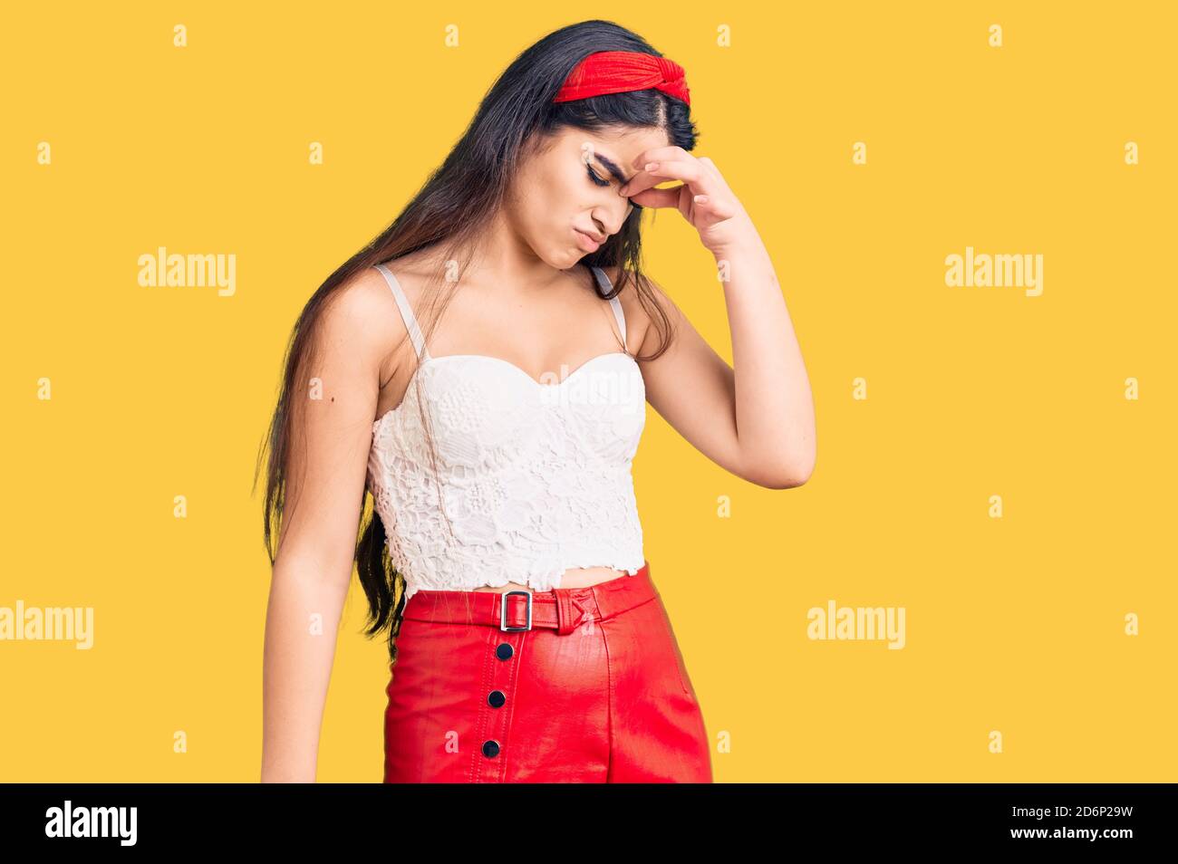 Brunette teenager girl wearing elegant look tired rubbing nose and eyes ...