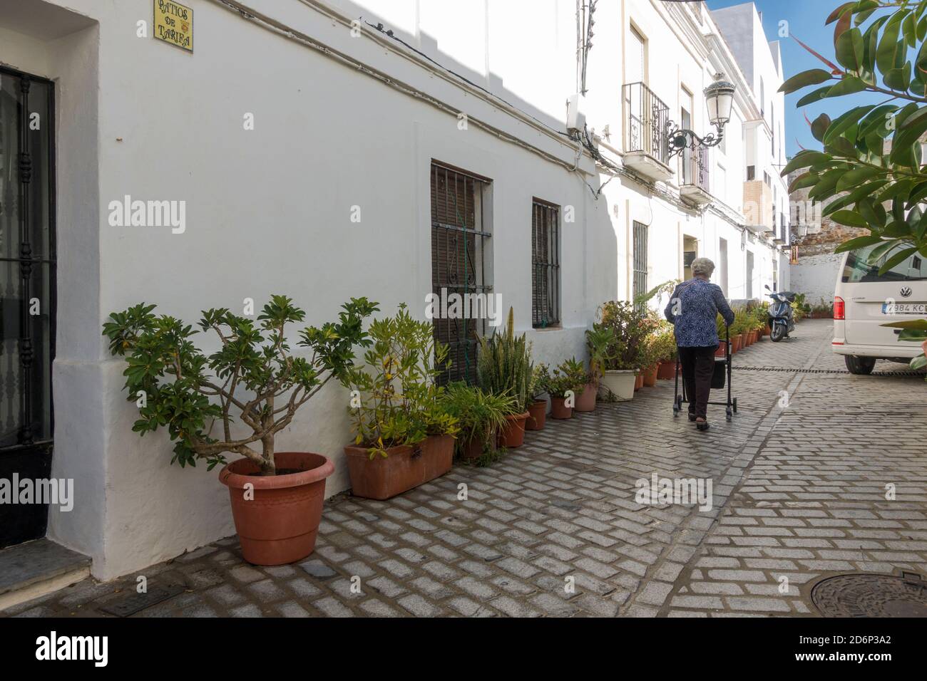 Street in Tarifa, Andalusian town historic city centre with plants and ...