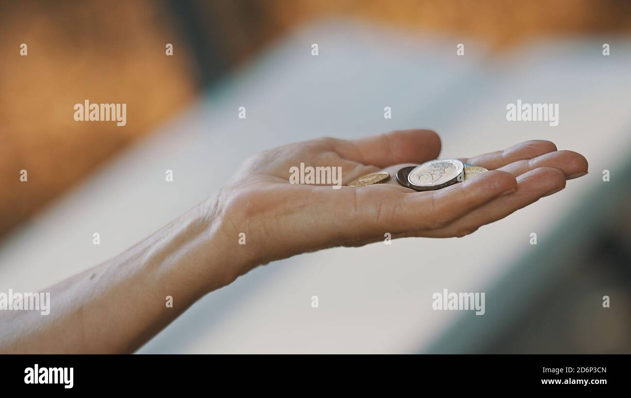Woman elderly hands begging hi-res stock photography and images - Alamy