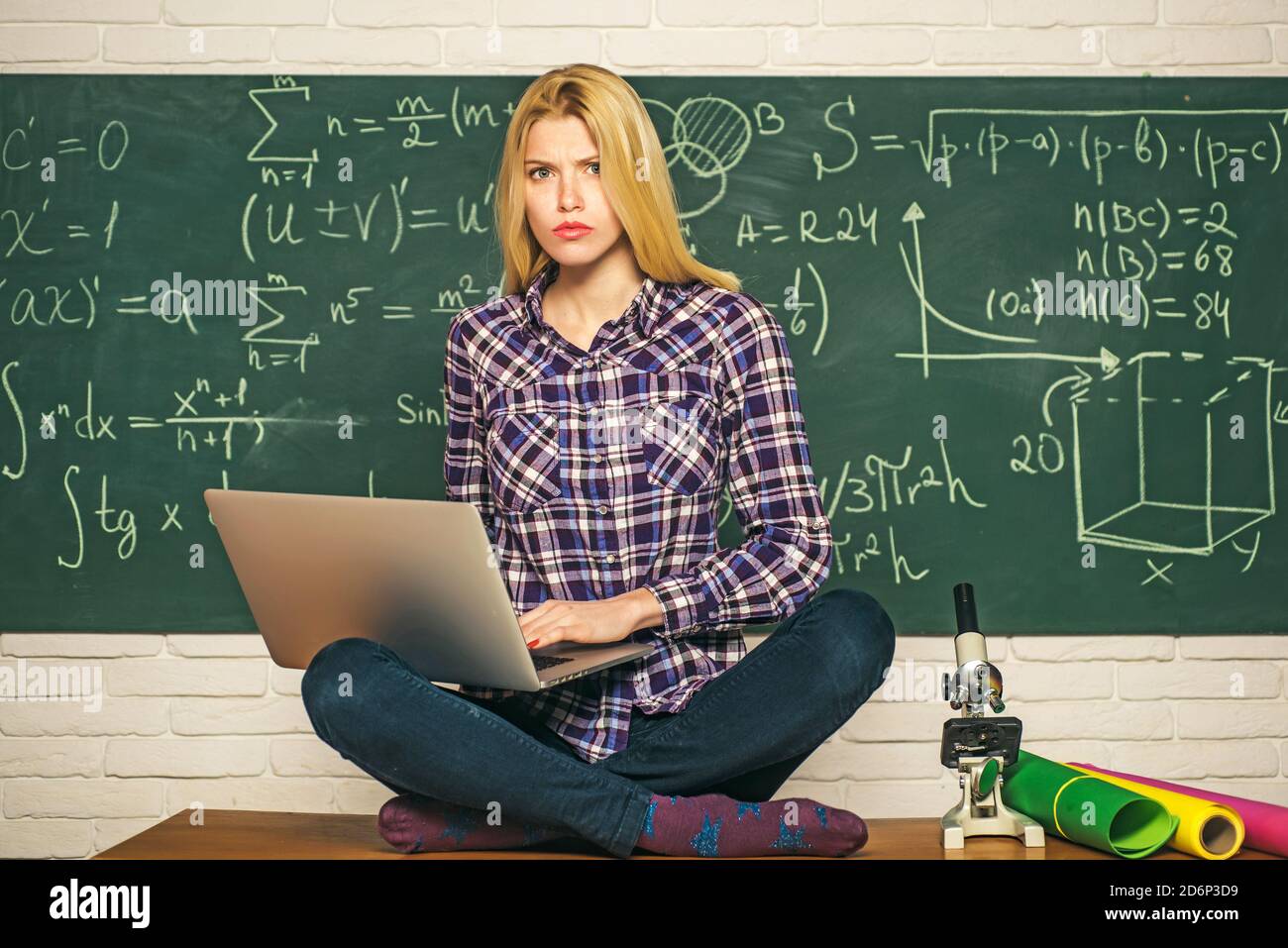 Confident in her knowledge. Portrait of college student on campus ...