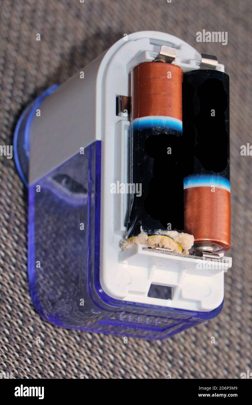 Small appliance with lithium battery leaking acid Stock Photo - Alamy