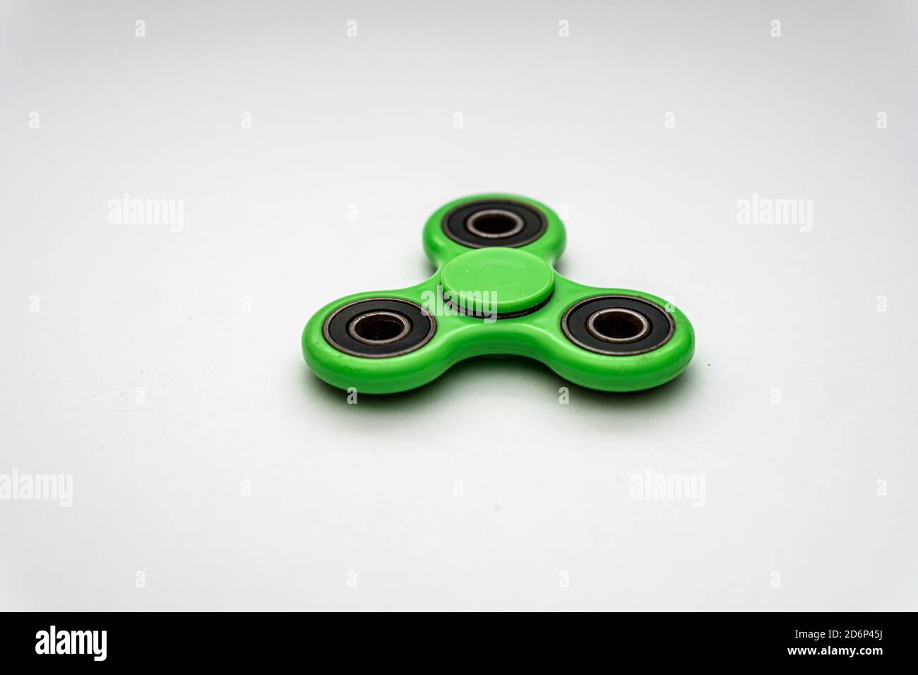 Green spinner isolated on a white background Stock Photo - Alamy