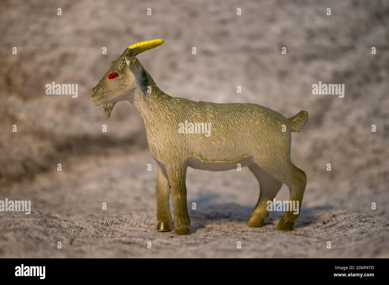 Closeup of a toy figurine of a goat Stock Photo - Alamy