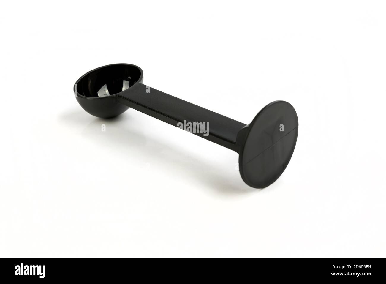 Black plastic coffee ground tamper and scoop angled away Stock Photo ...