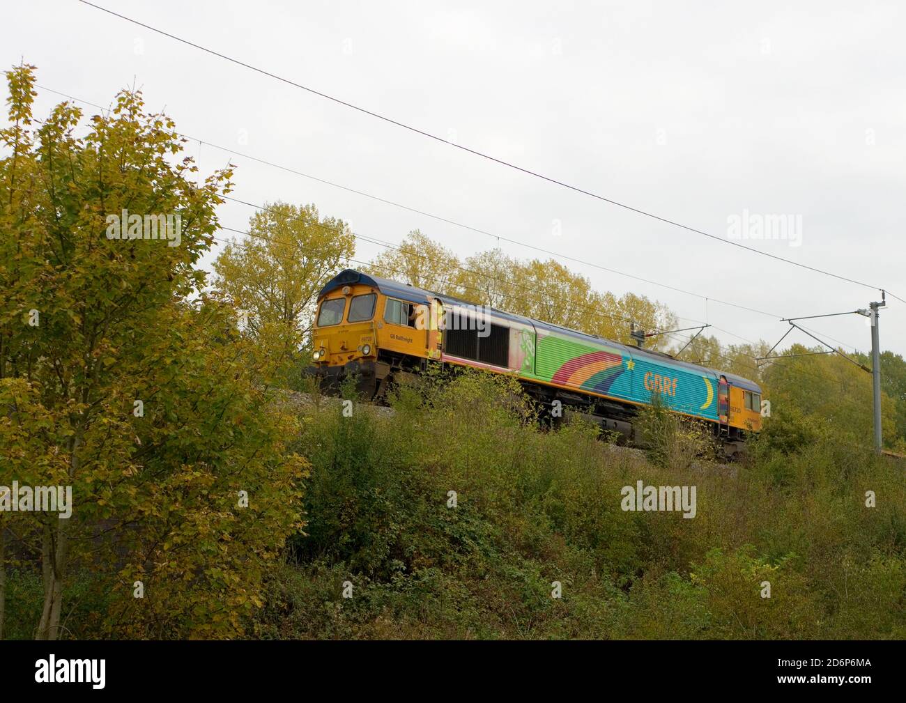 Colourful Class 66 locomotive 66720 passes through Harlestone Firs on ...