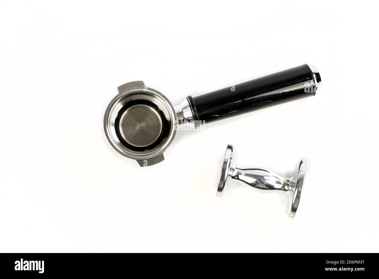 Black and silver coffee filter holder with a metal coffee tamper close ...