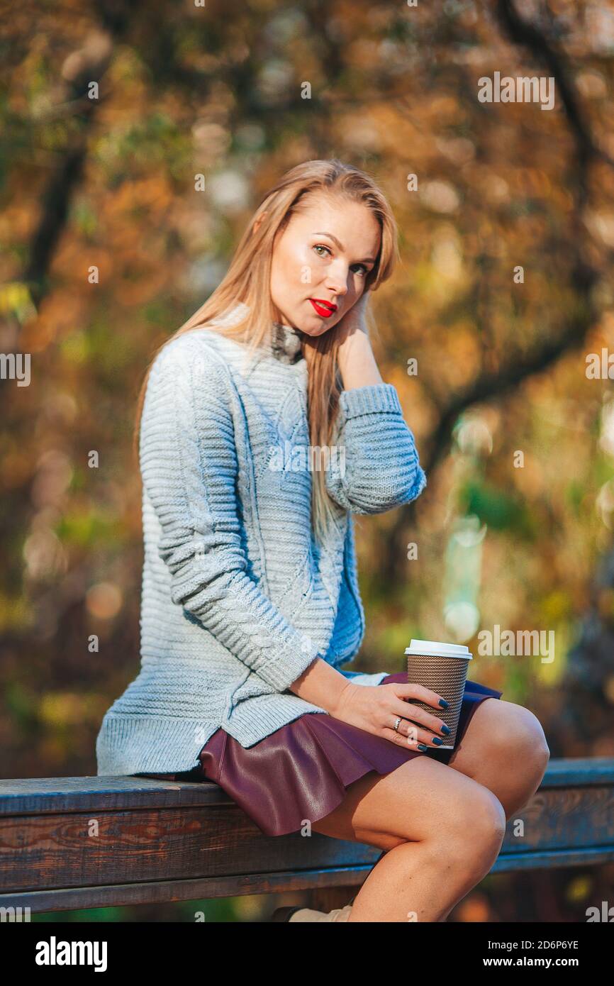 Fall concept - beautiful woman in autumn park under fall foliage Stock ...
