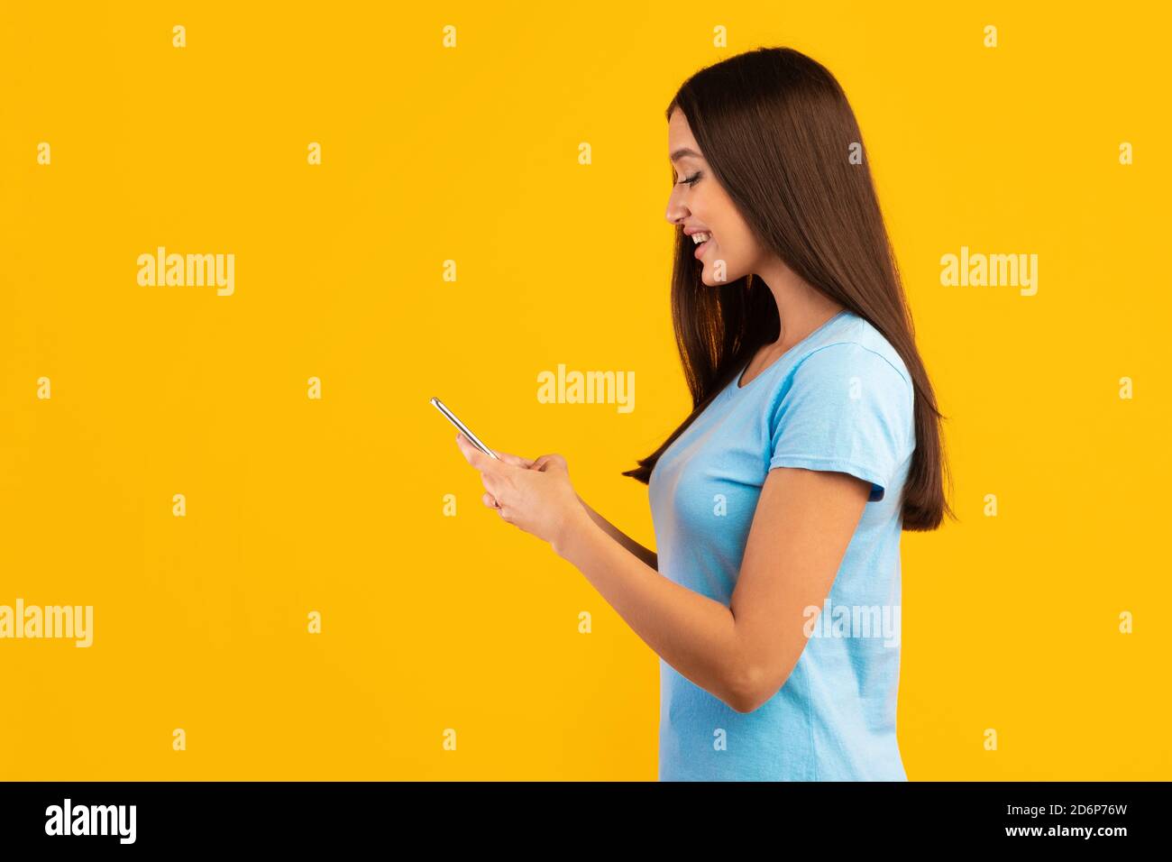 Portrait of beautiful young lady using her mobile phone Stock Photo - Alamy