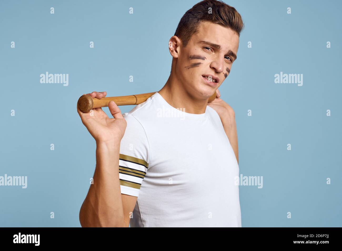 baseball guy with a bat in his hand on a blue background and a combat ...