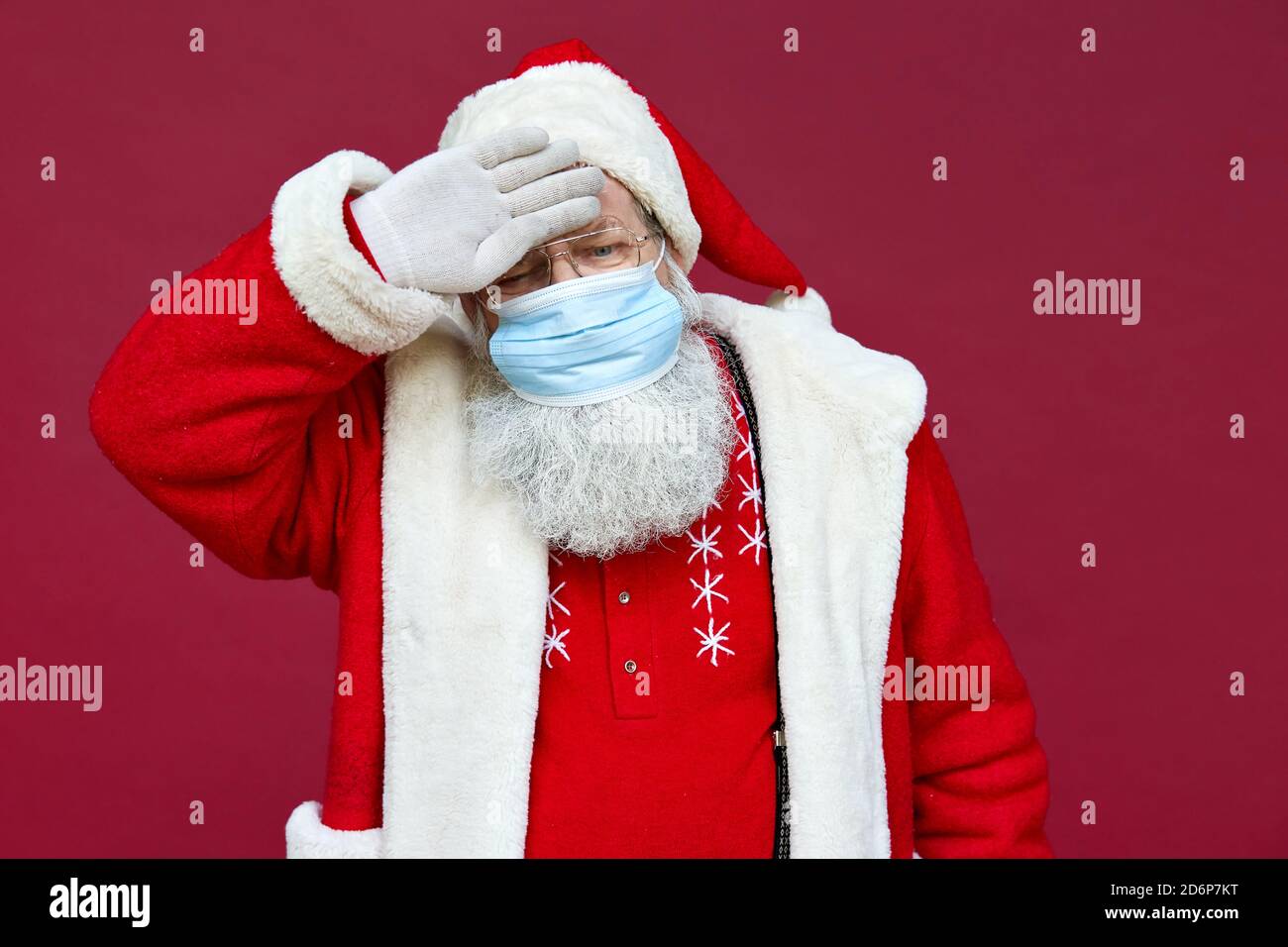 Sick ill Santa wearing face mask having fever or headache on red ...