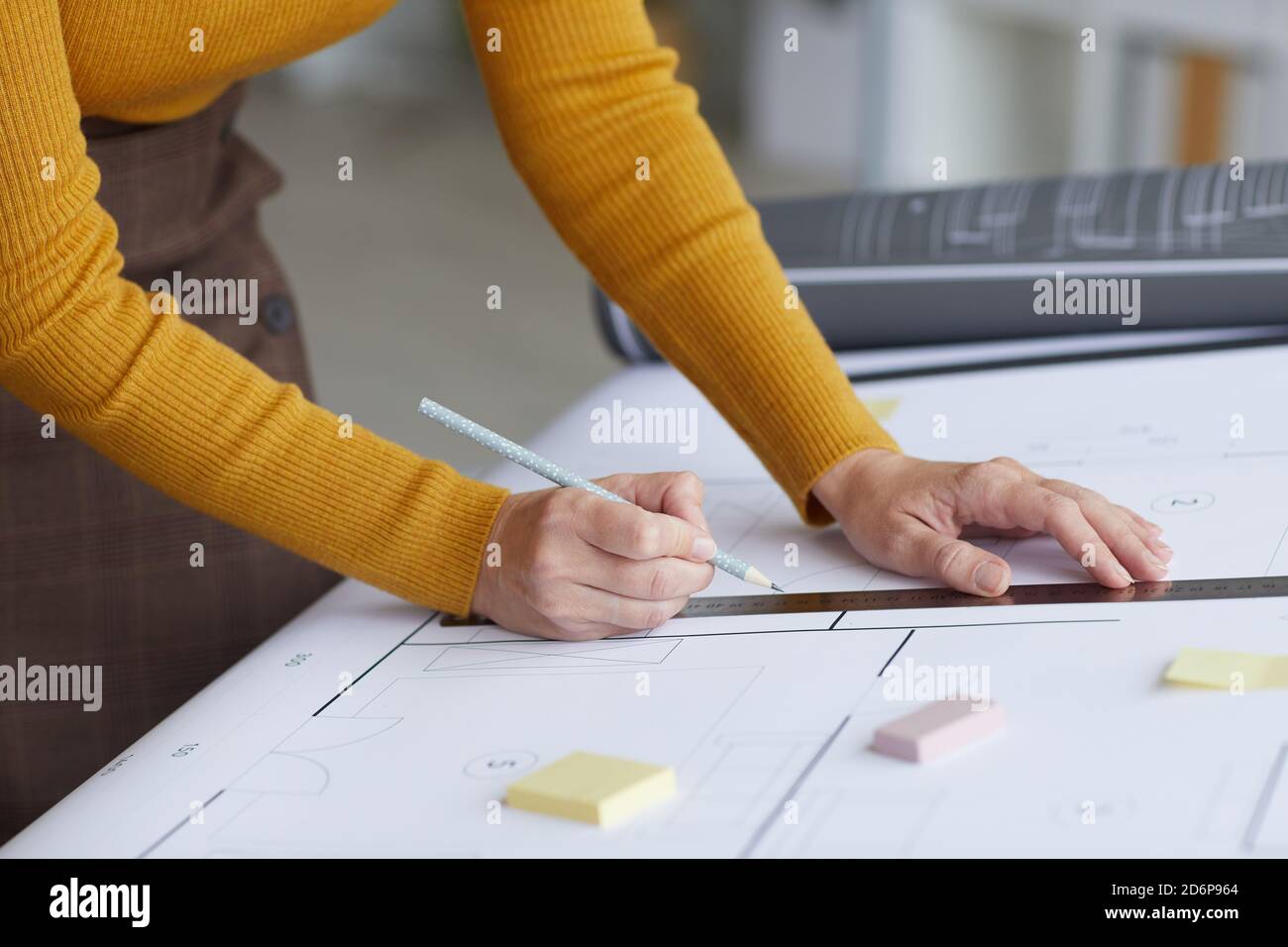 Side view close up of unrecognizable female architect drawing ...