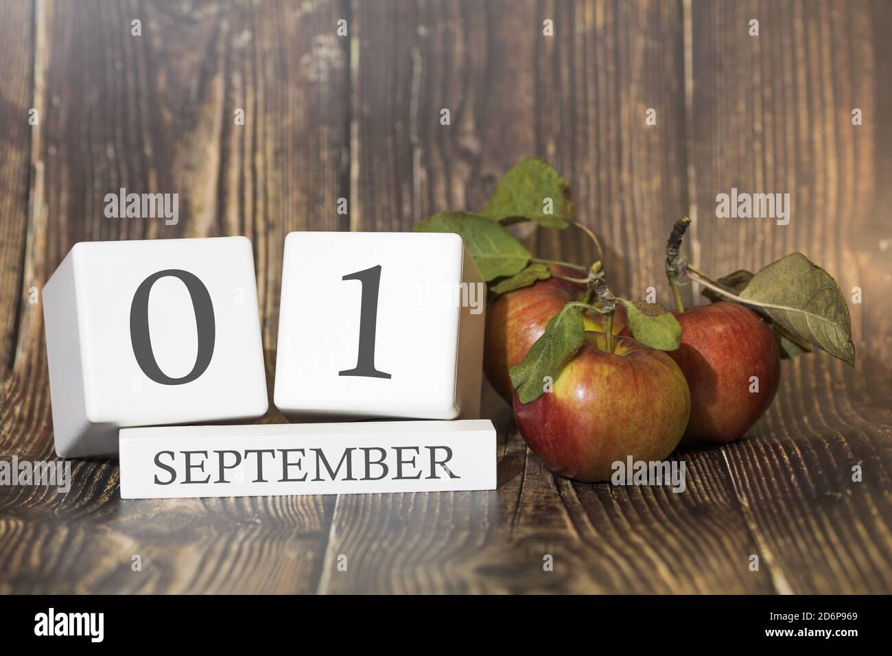 September 1. Day 01 of month. Calendar cube on wooden background with ...
