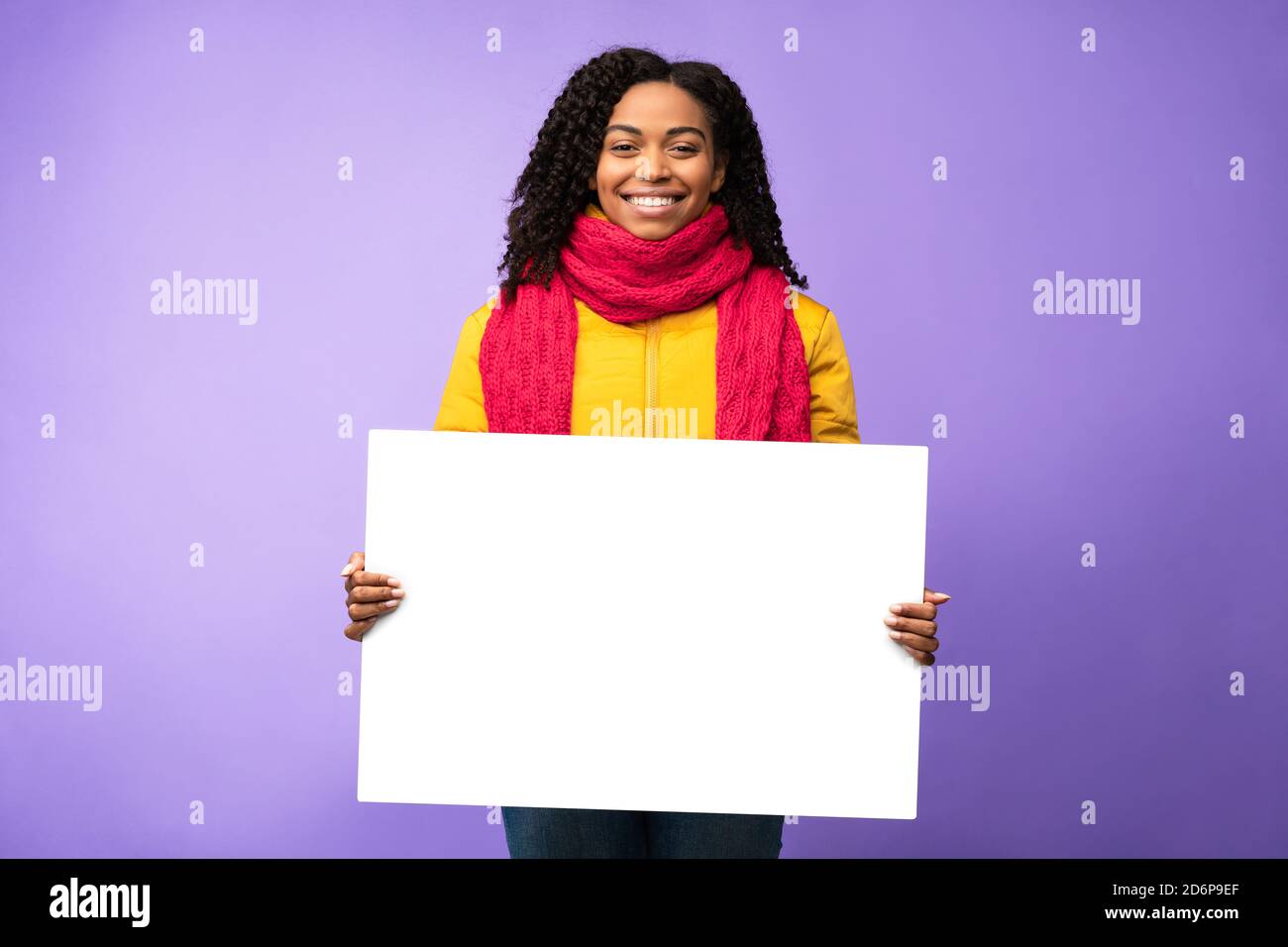 Black Lady Holding Empty Poster Board Standing On Purple Background ...