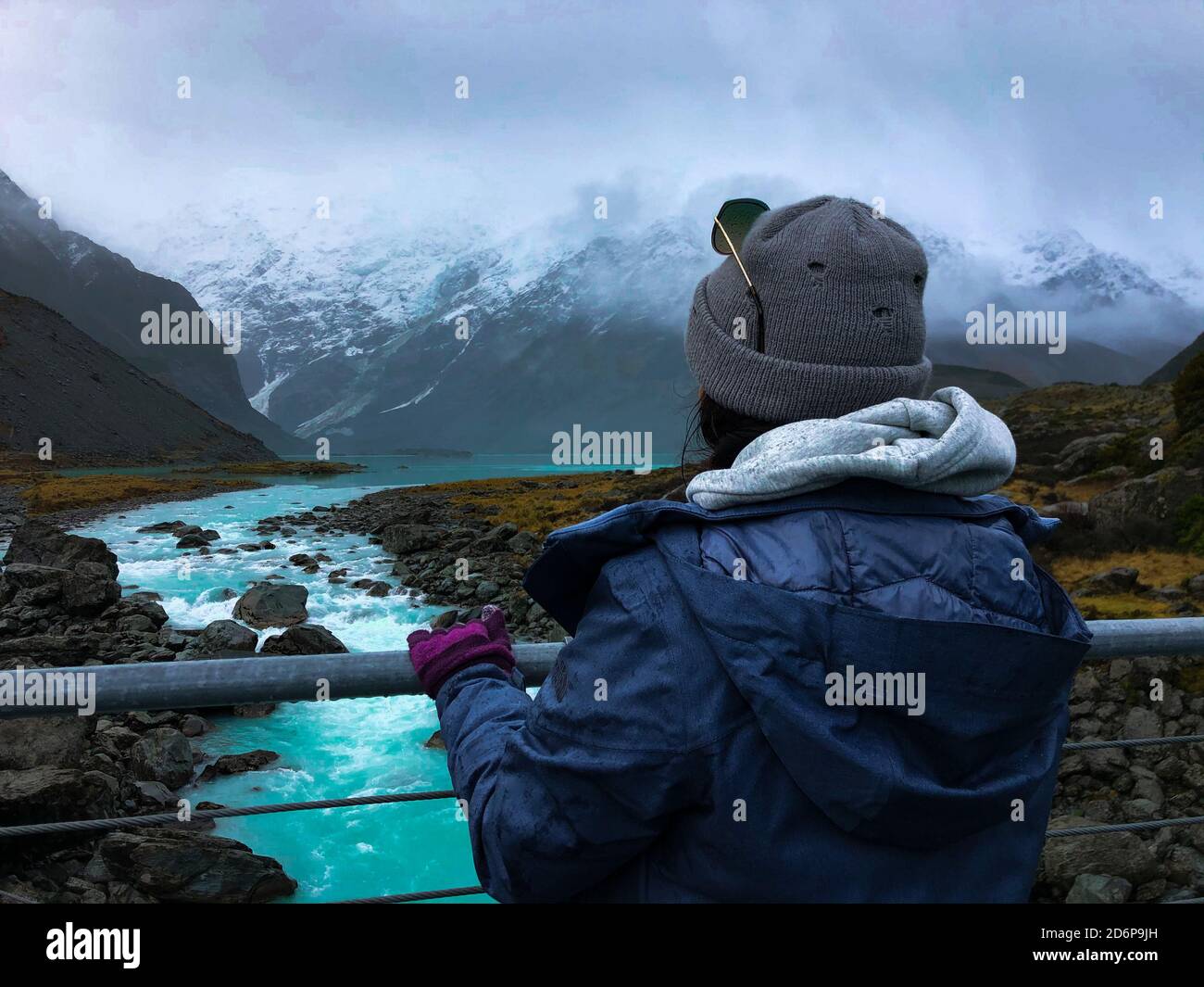 Back view of a female hiker enjoying beautiful nature scenes Stock ...