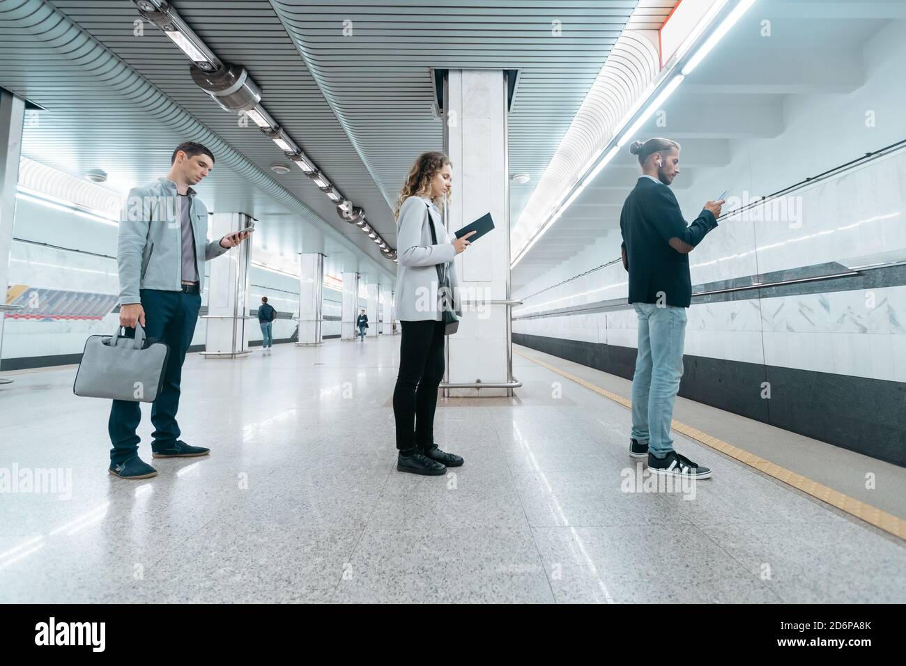 various subway passengers waiting for the arrival of the train Stock ...