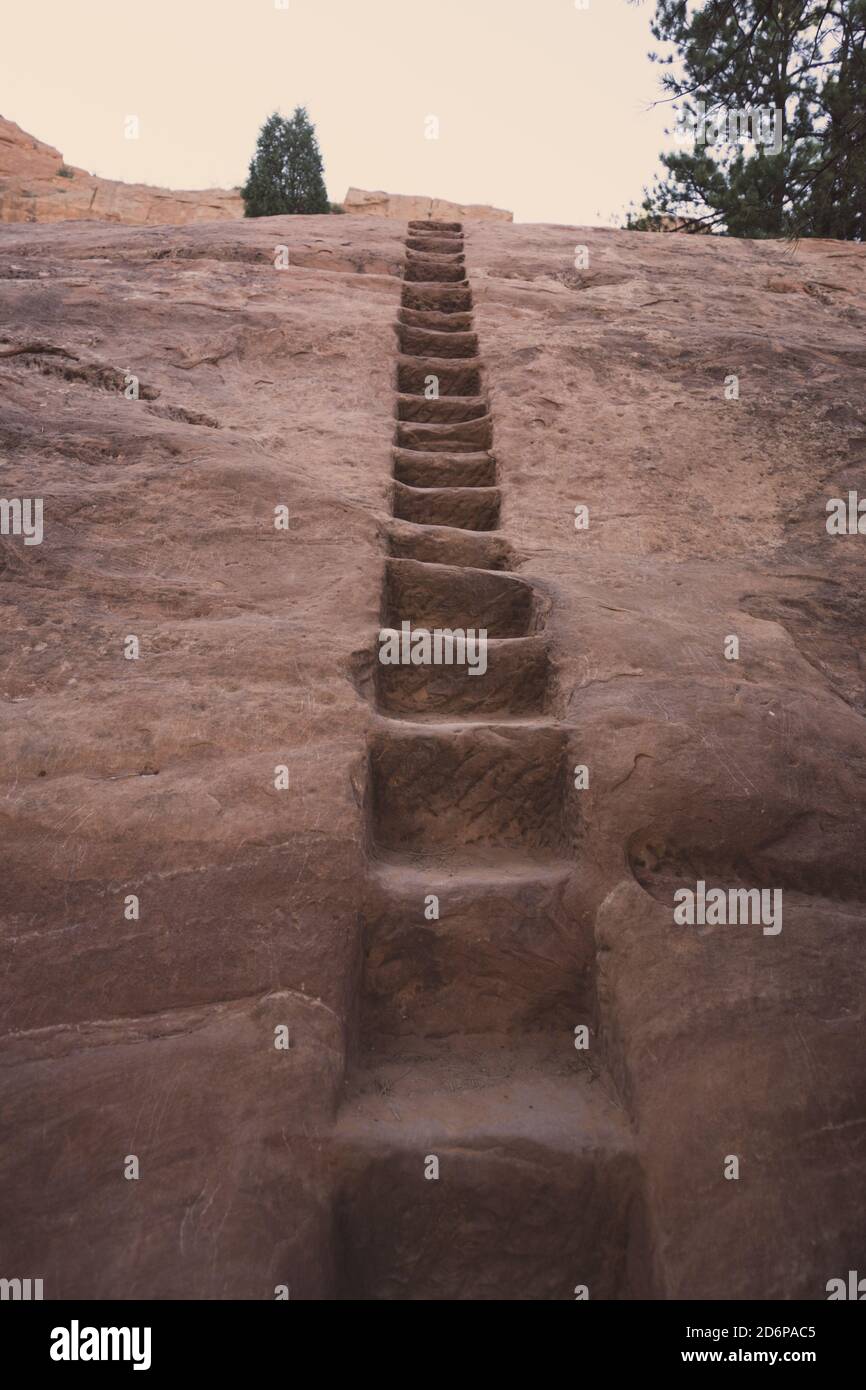 Hiking steps carved into a staircase in a steep rock, in Red Rocks open ...