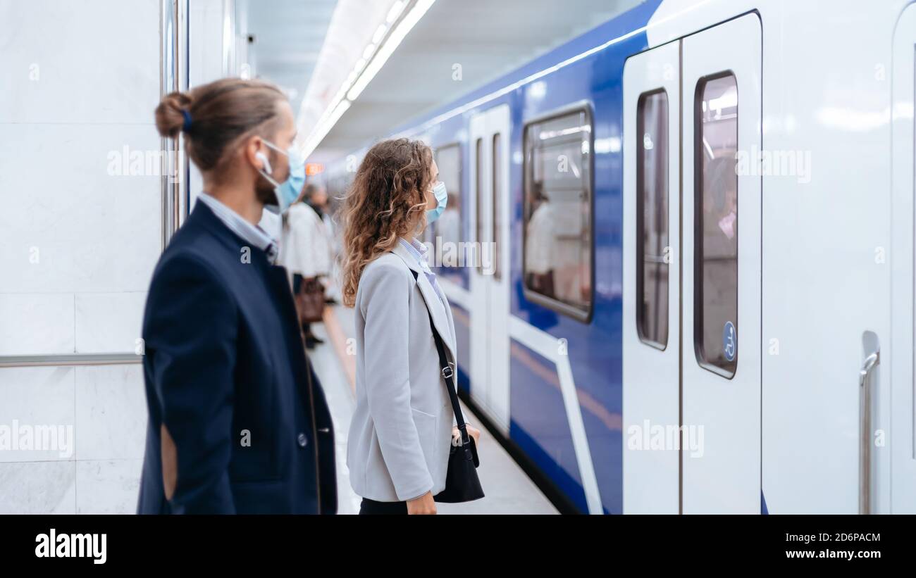 metro passengers standing at a safe distance on the platform Stock ...