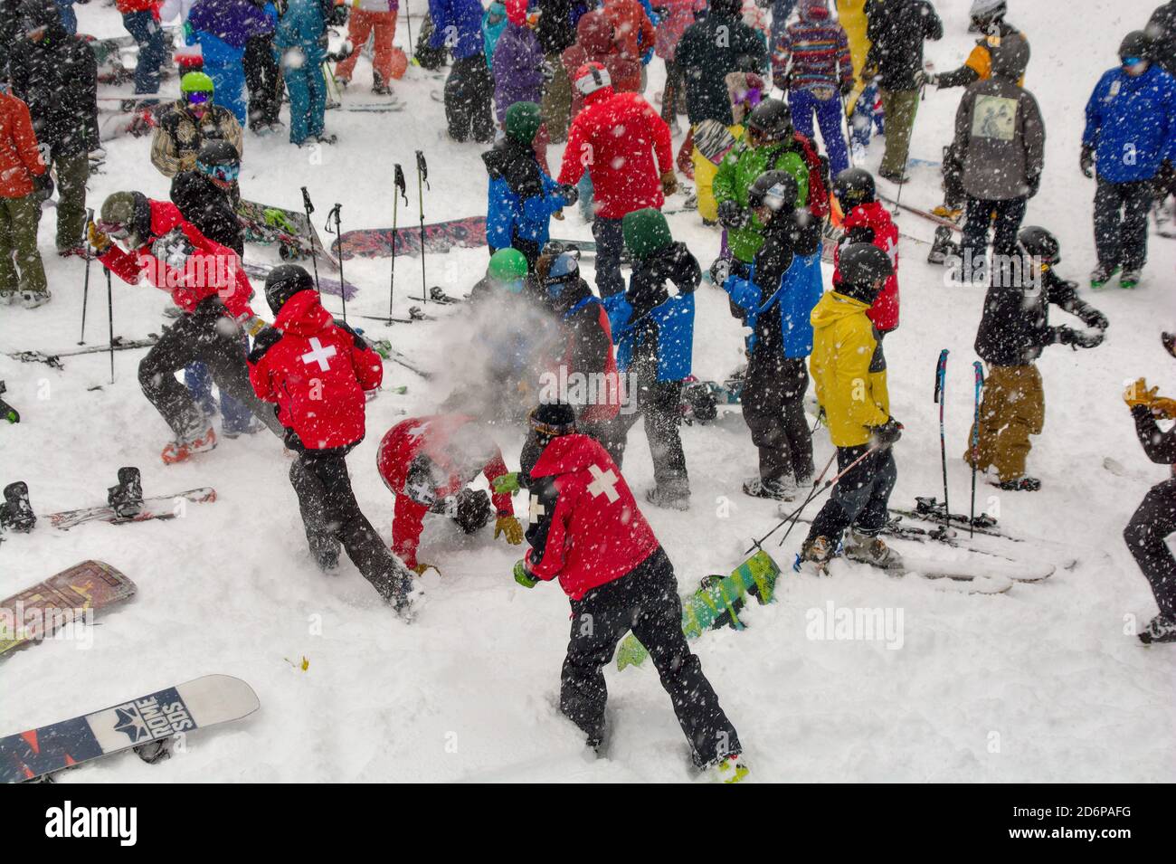 Snowball fight at a ski resort, the ski patrol giving it their all ...