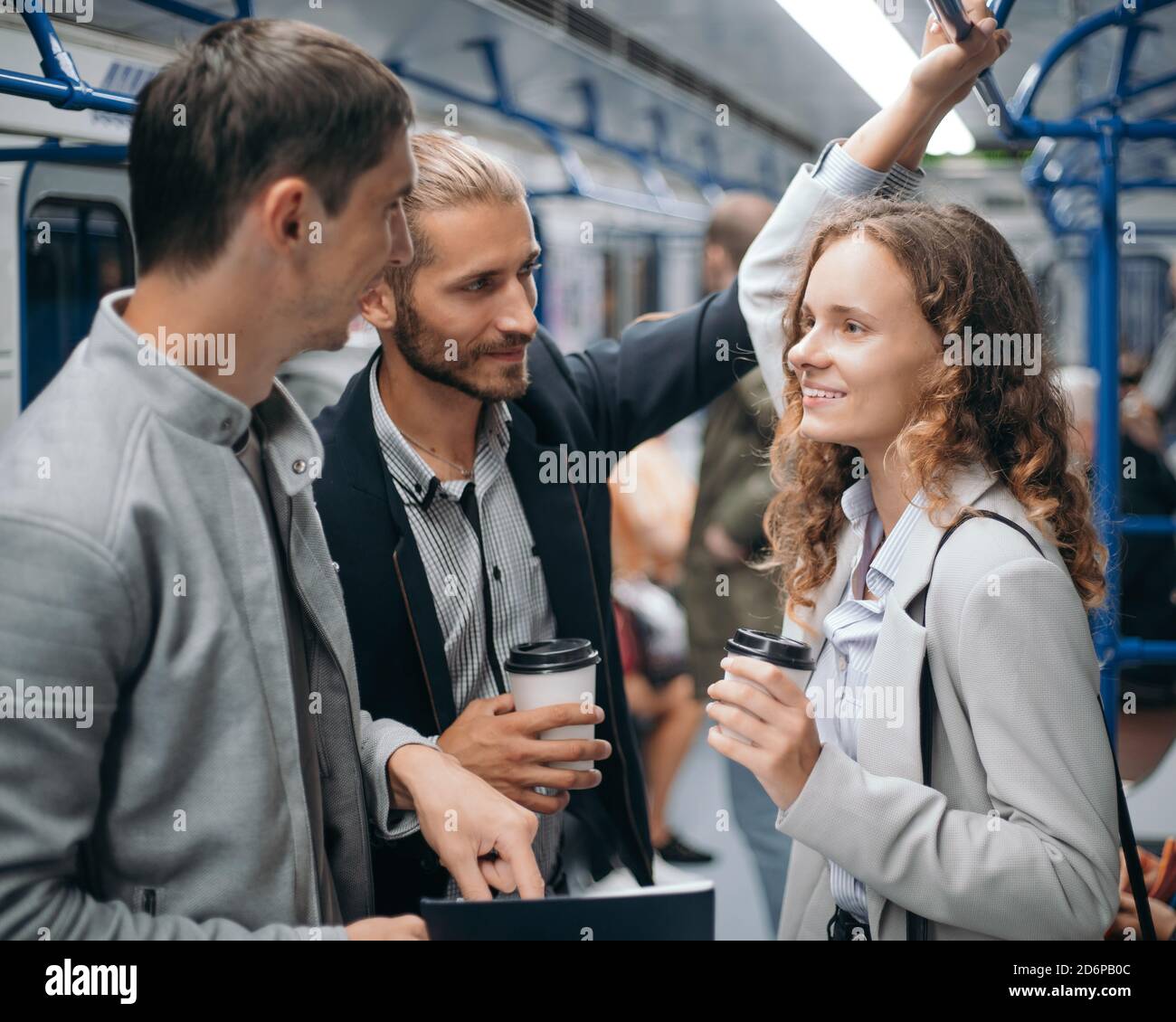 group of students discussing something in the subway car Stock Photo ...