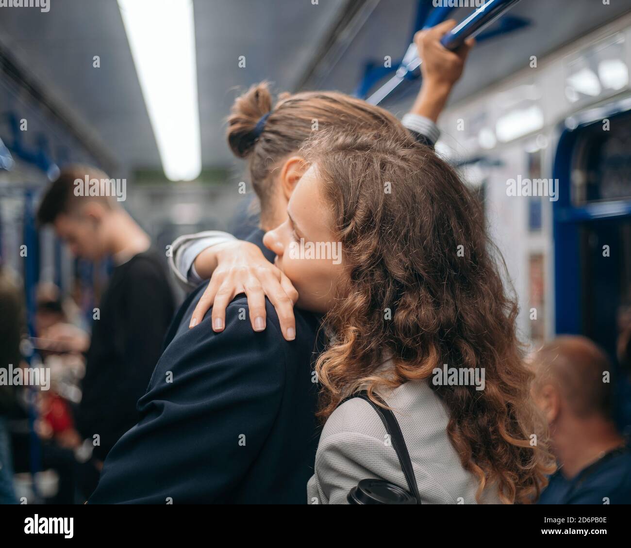 couple in love embraces on a subway train Stock Photo - Alamy