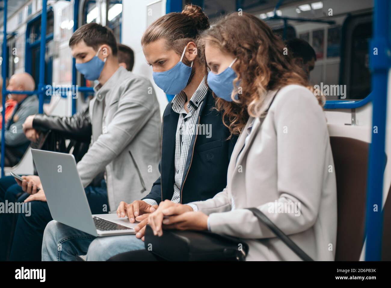 subway passengers with laptops sitting in the car Stock Photo - Alamy