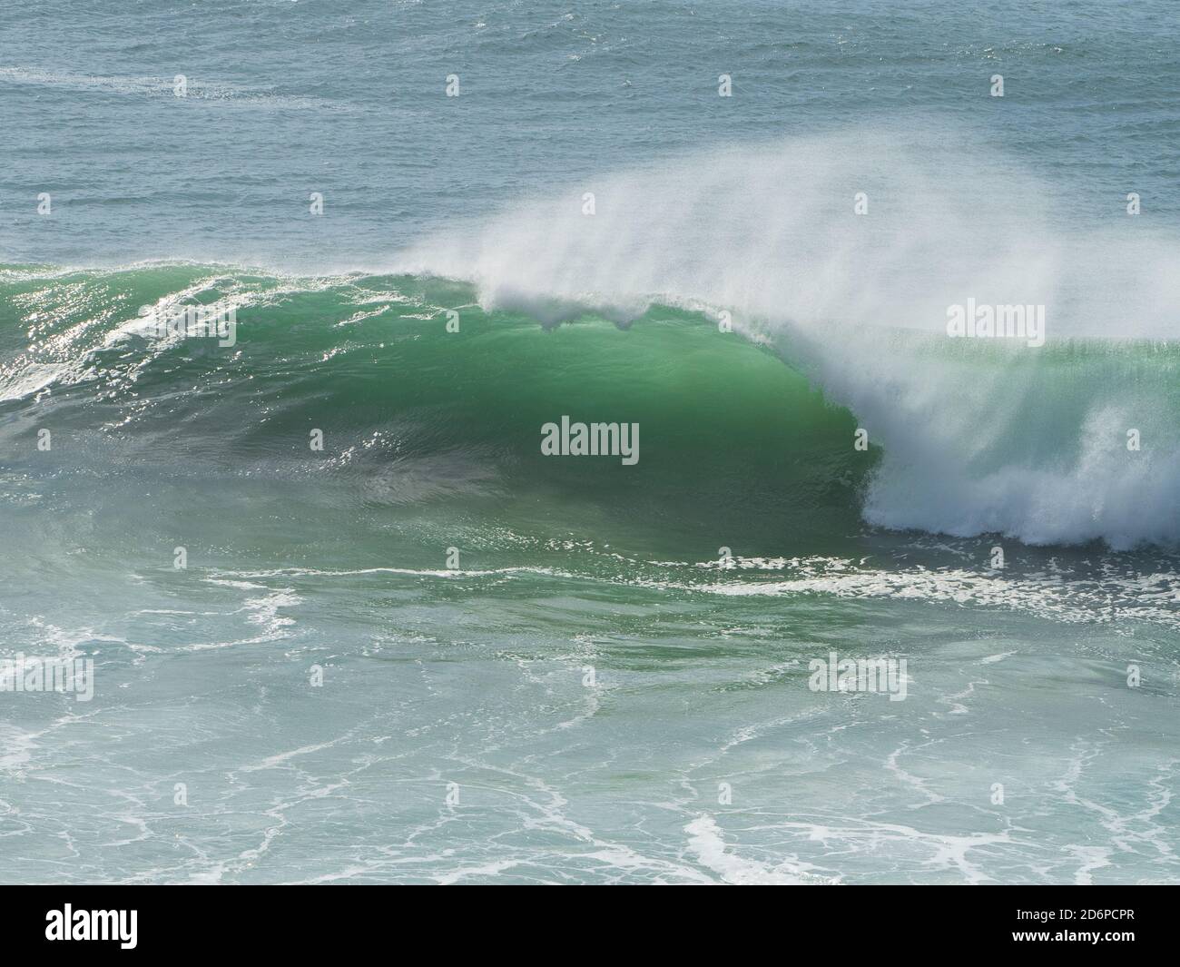 Wave rolling over Stock Photo - Alamy