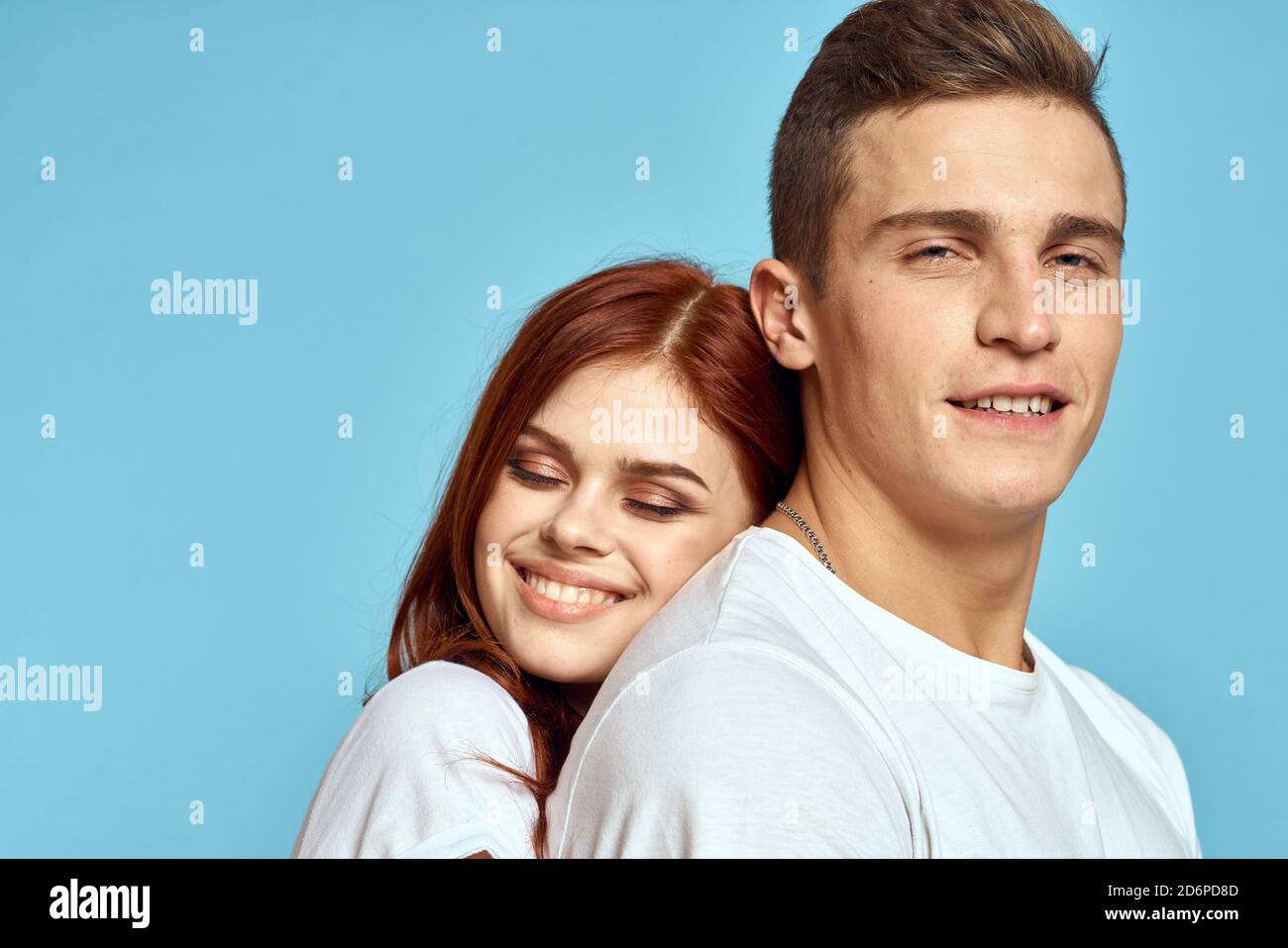 young family love hug cropped view blue background close-up Stock Photo ...