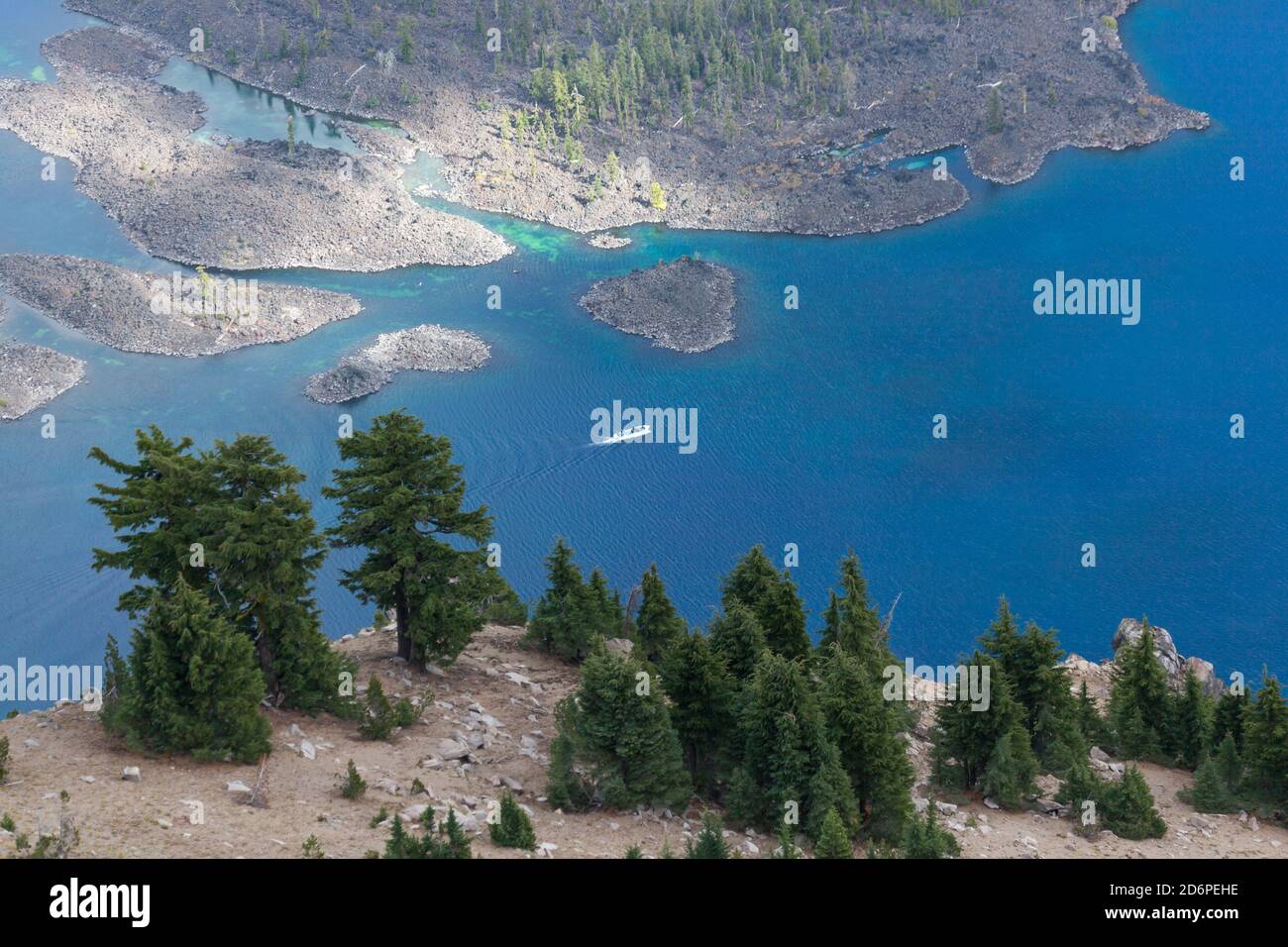 A tour boat takes people around the the magnificently blue and deep ...