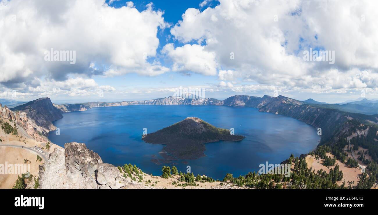 A dramatic high elevation view of the deep blue Crater Lake and Wizard ...