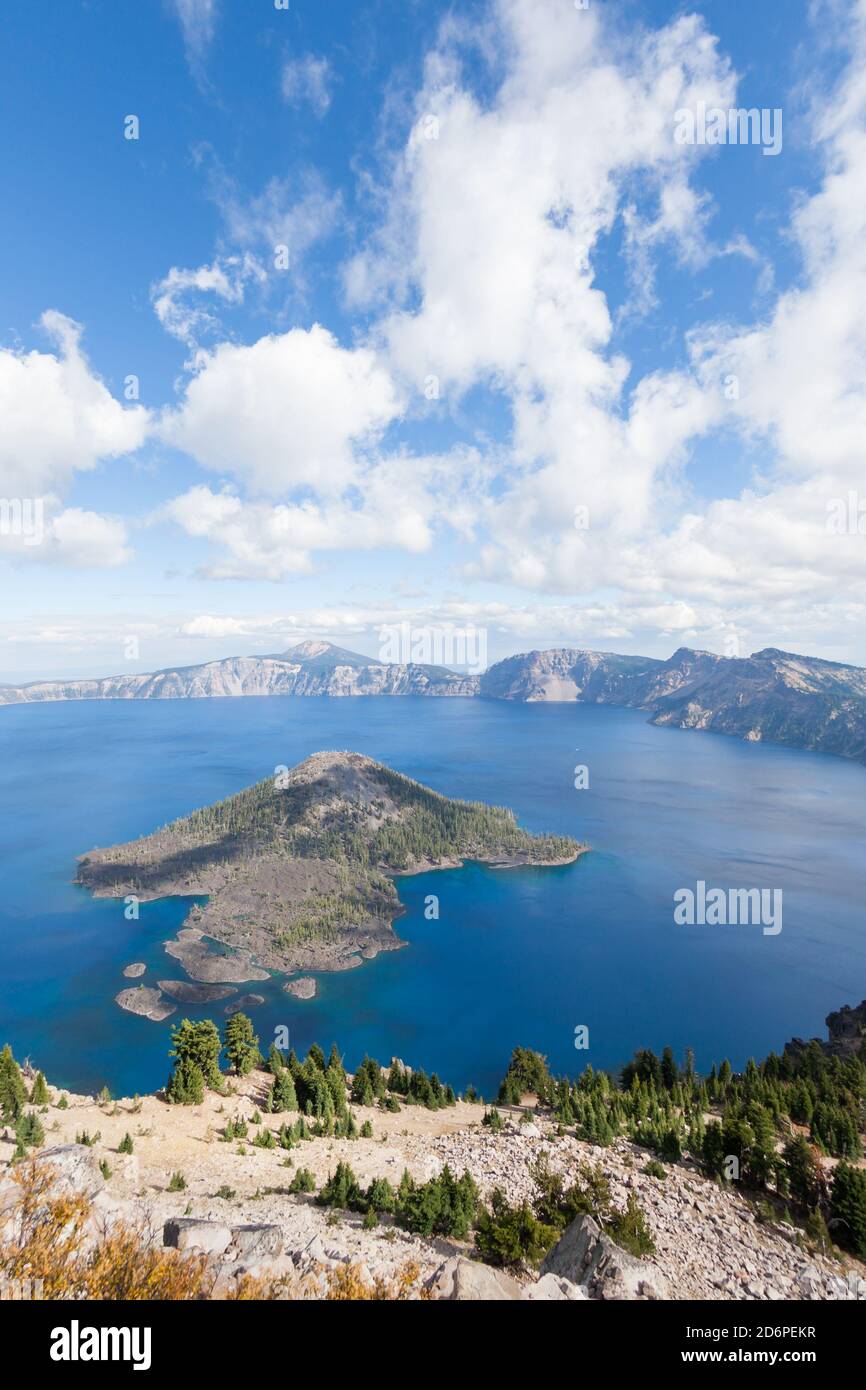 A dramatic high elevation view of the deep blue Crater Lake and Wizard ...