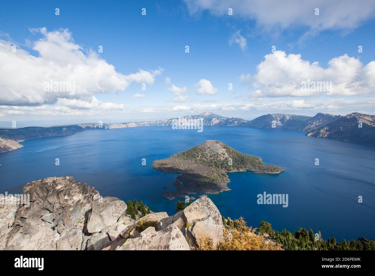 A dramatic high elevation view of the deep blue Crater Lake and Wizard ...