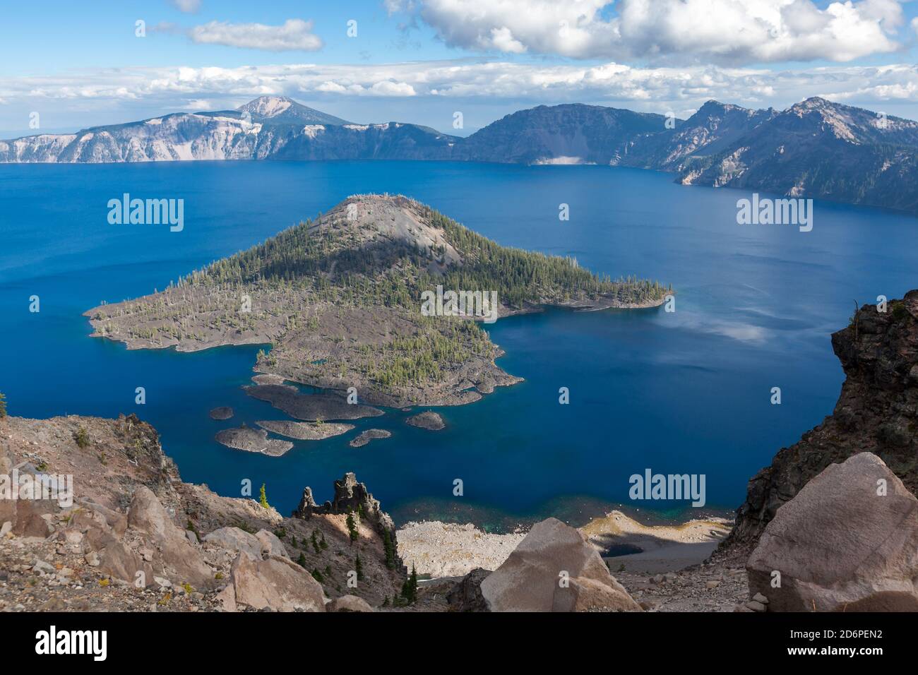 A dramatic high elevation view of the deep blue Crater Lake and Wizard ...