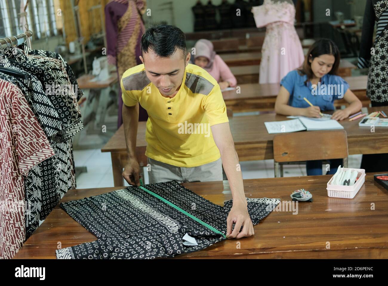 Asian tailors measure clothes with a ruler according to the rules in ...