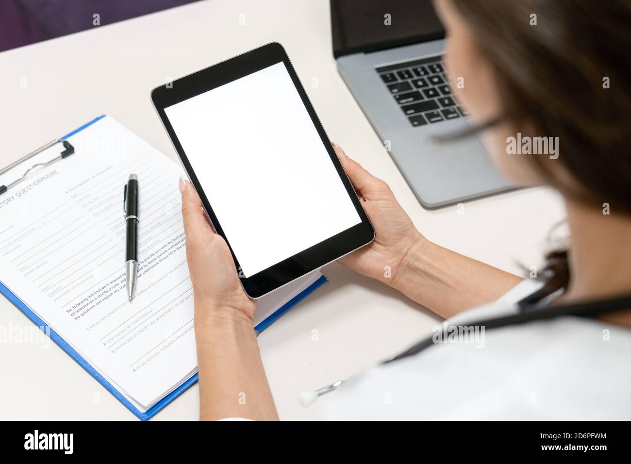 Mockup on tablet with female doctor wear headset make online video call ...