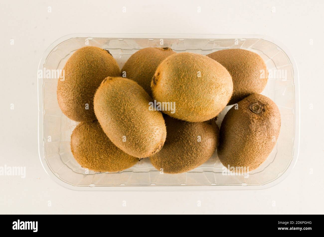 Kiwi in a box isolated Stock Photo - Alamy