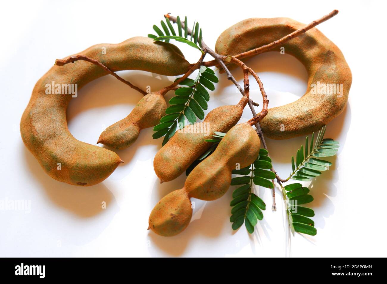 a top view of fresh raw tamarind group isolated on white background ...