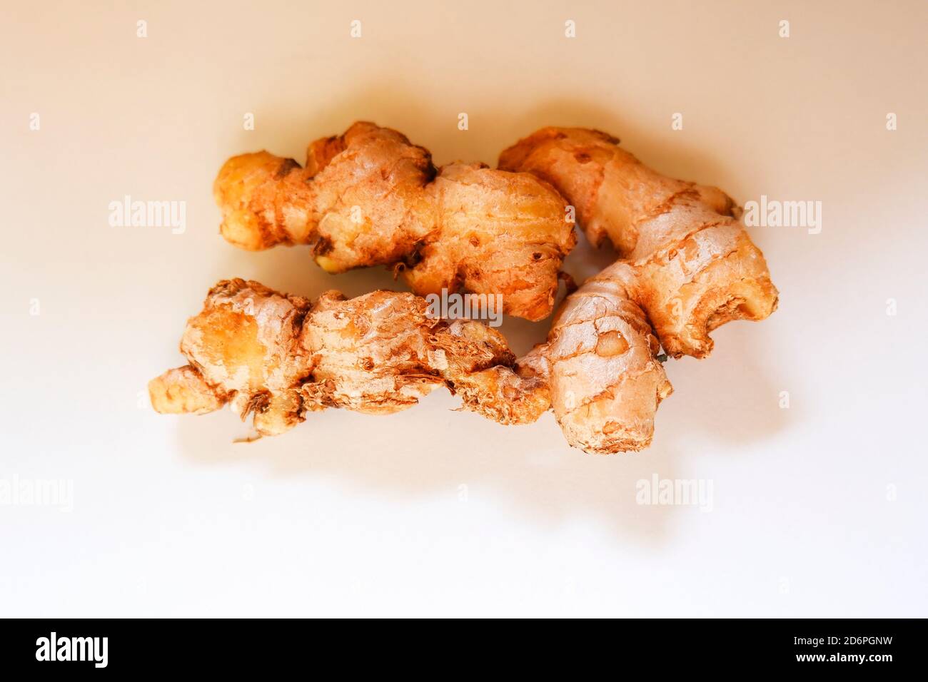 a top shot of fresh ginger group on plain white background Stock Photo ...