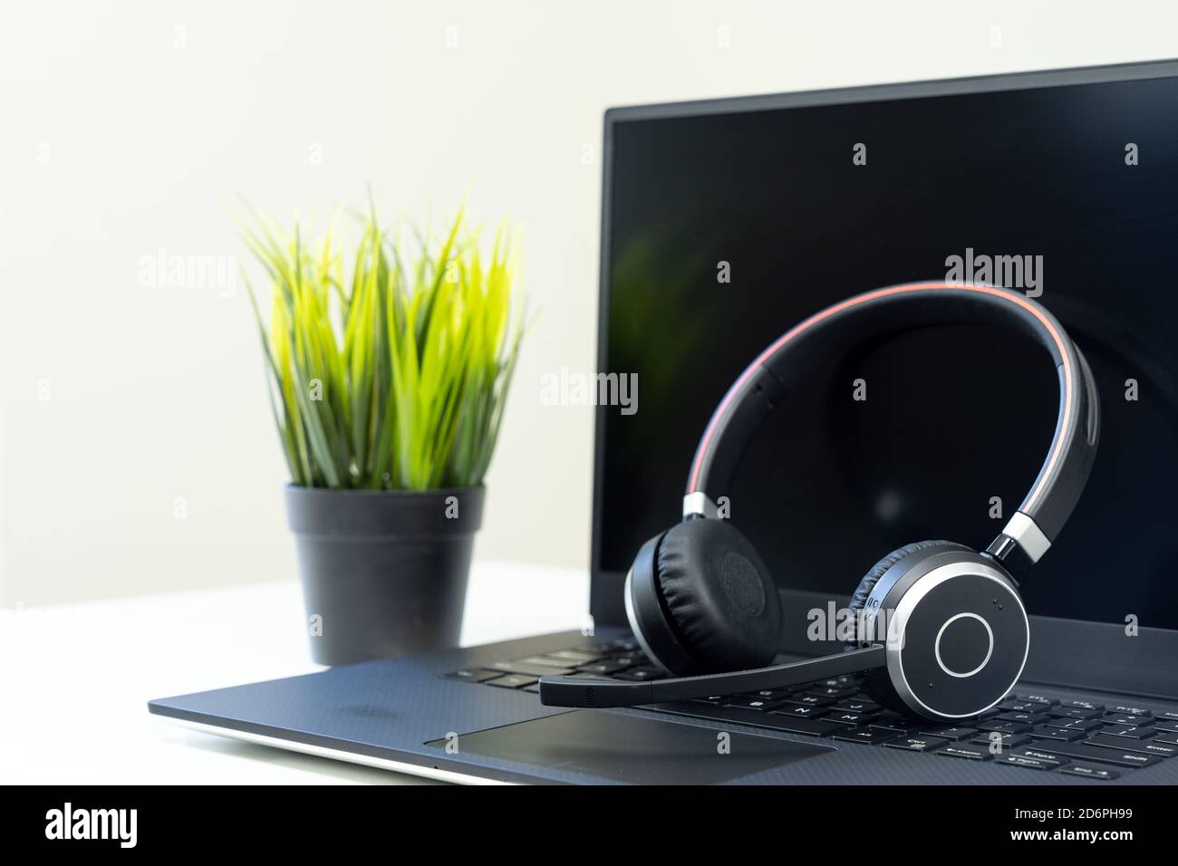 Headphone with laptop in office Stock Photo - Alamy