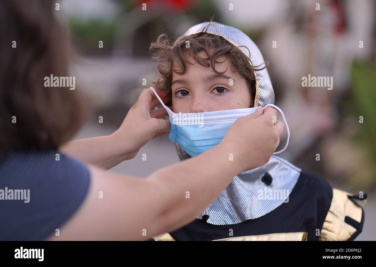 Putting On Face Covering High Resolution Stock Photography and Images ...